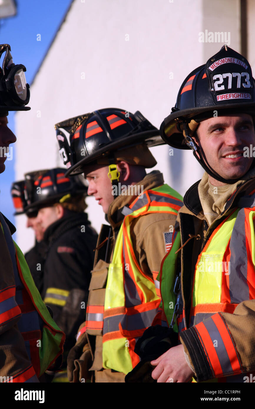 A group of firefighters at an emergency scene Stock Photo - Alamy