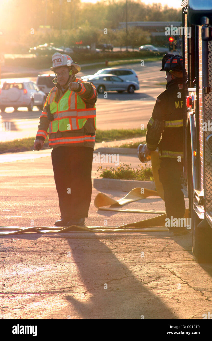 A Fire Chief directing firefighters at an emergency scene Stock Photo ...