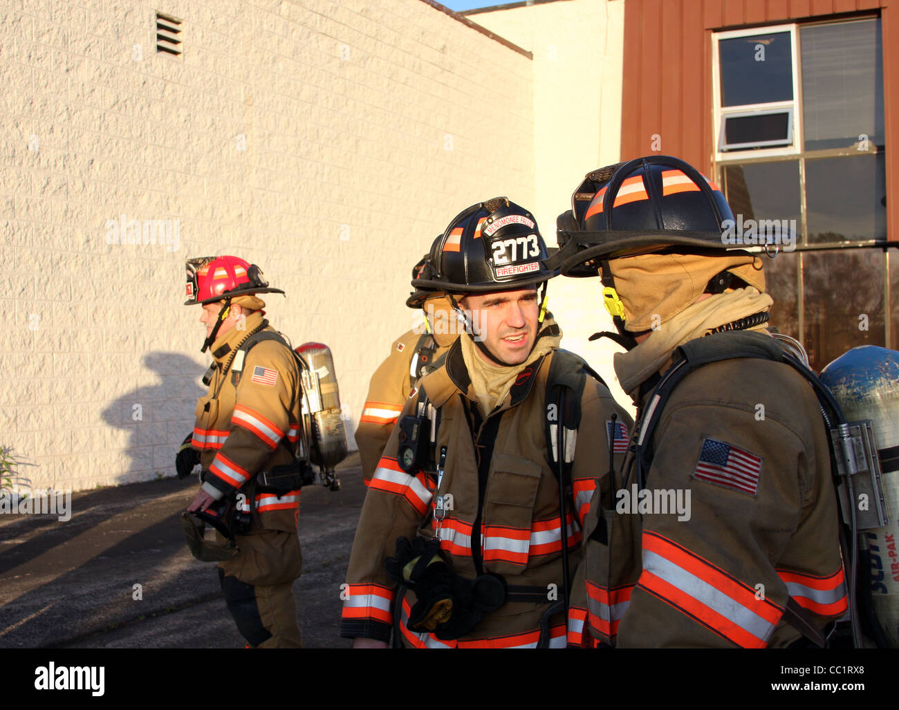 Firefighters on an emergency scene Stock Photo - Alamy
