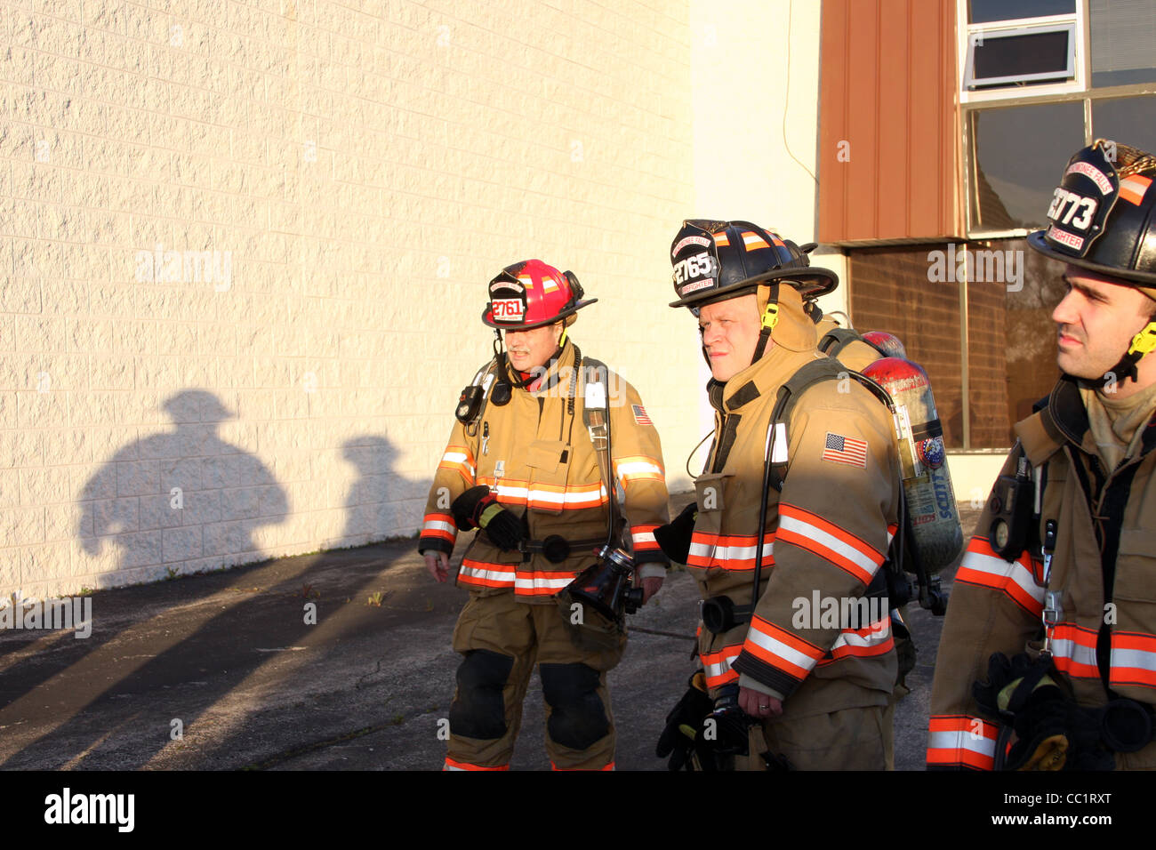 Firefighters on an emergency scene Stock Photo - Alamy