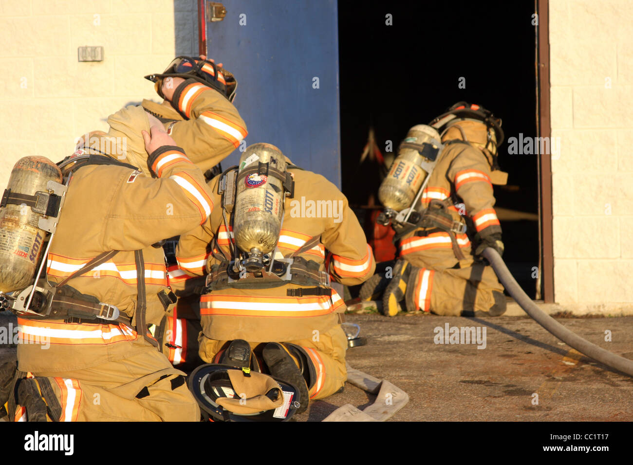 Firefighters entering a building for search and rescue Stock Photo - Alamy