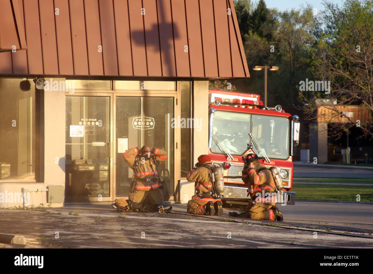 Firefighters entering a building for search and rescue Stock Photo - Alamy