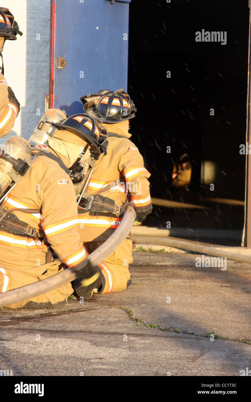 Firefighters entering building rescue hi-res stock photography and ...