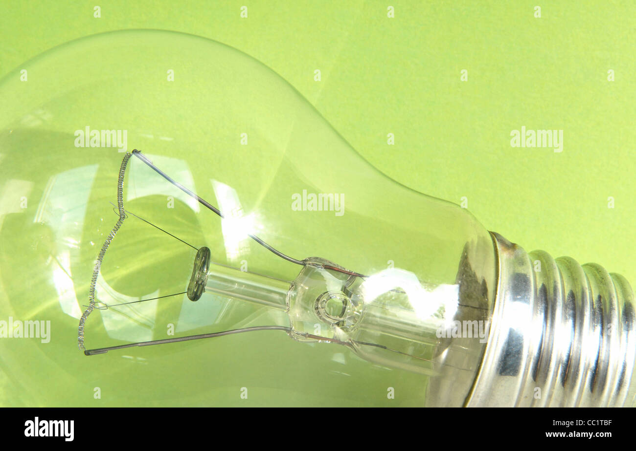 Green Power - Light bulb on green background Stock Photo - Alamy