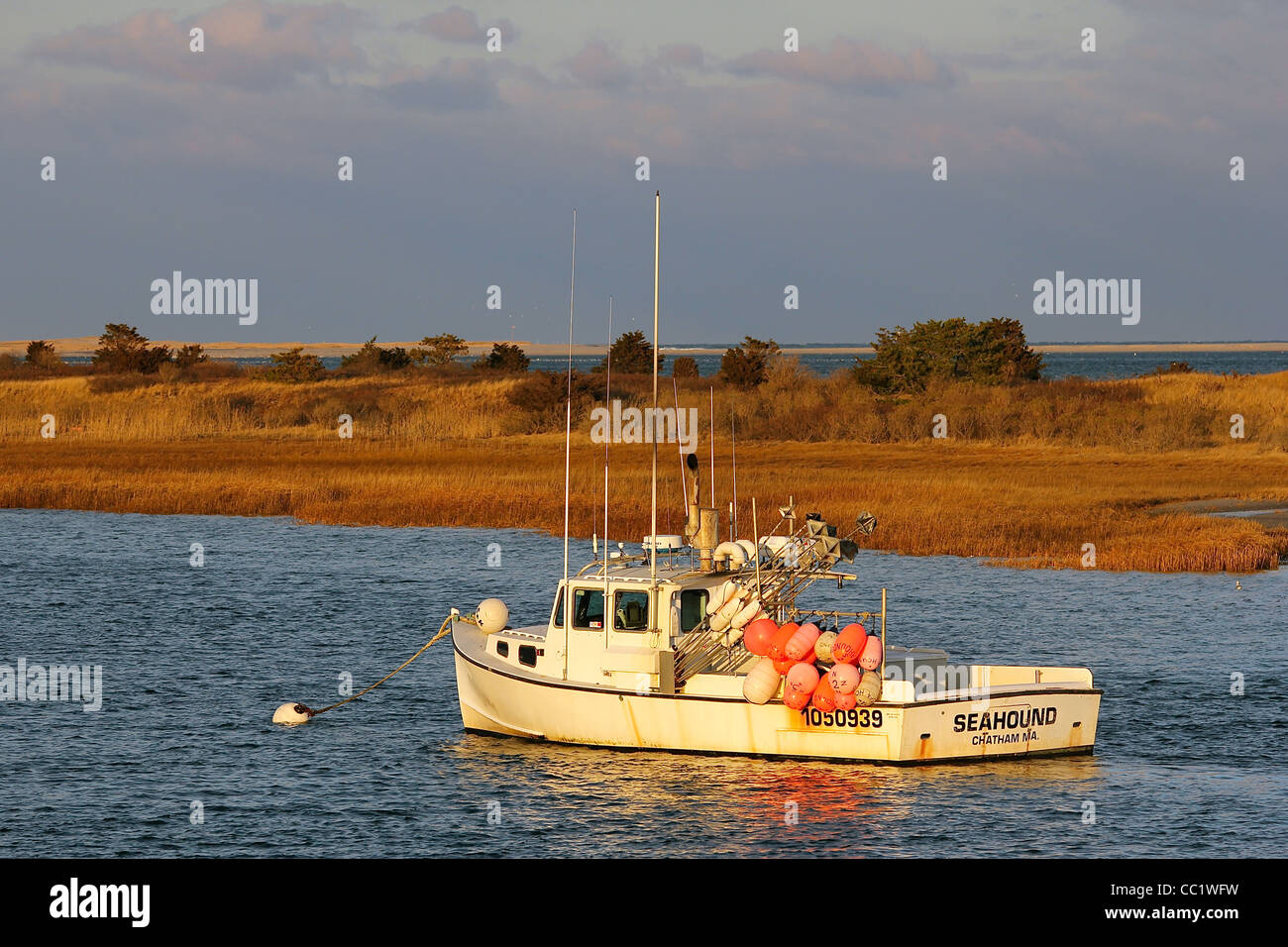 A fishing boat anchored near the Chatham Fish Pier on Cape Cod ...