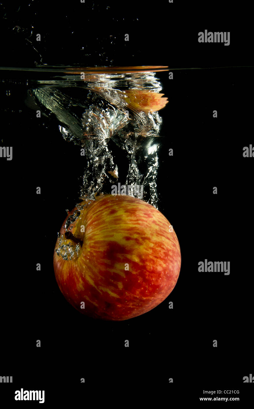 Red Apple Falling into Water with underwater perspective with air ...