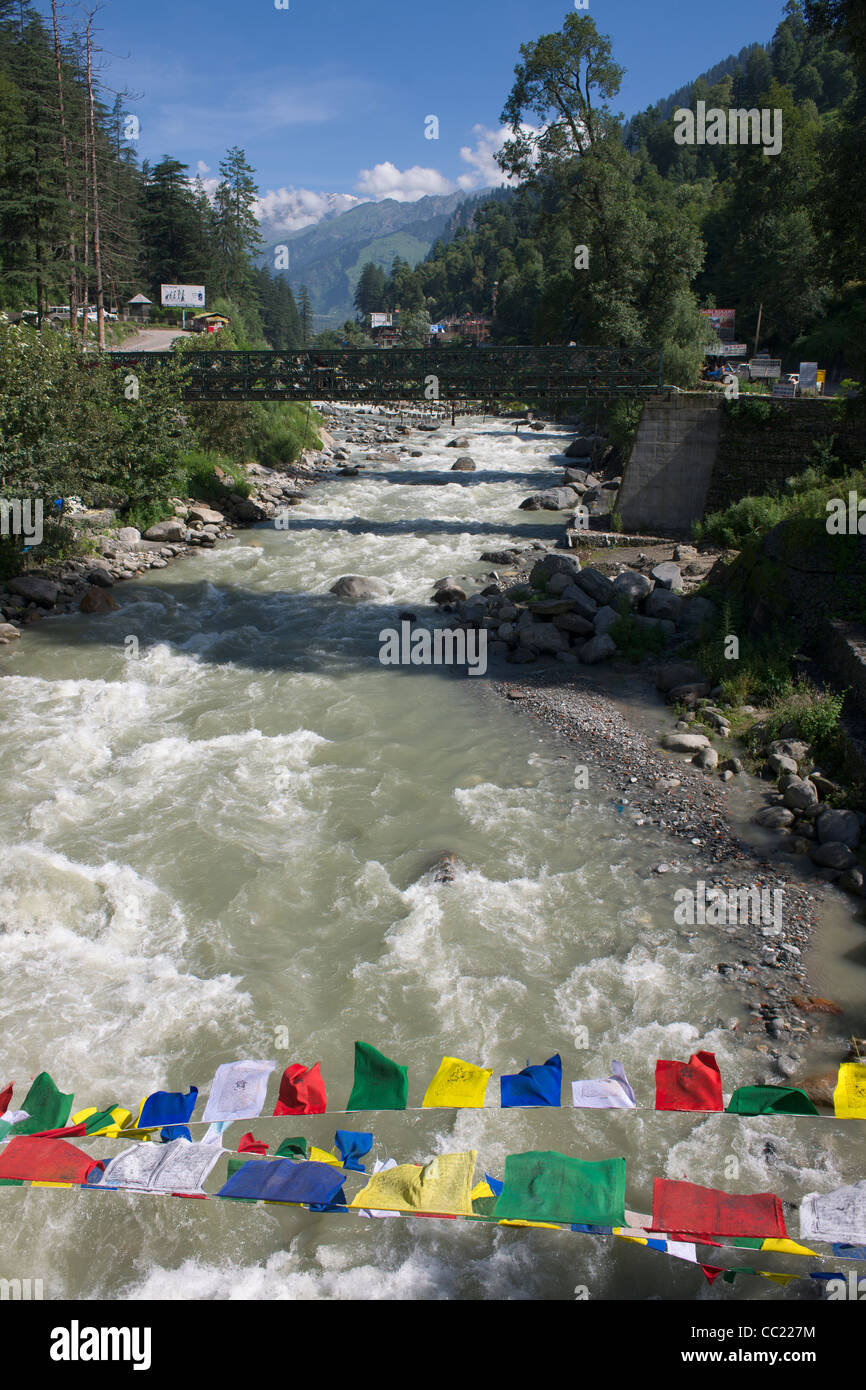 Prayer flags and bridge over the Beas River, Manali, Himachal Pradesh ...