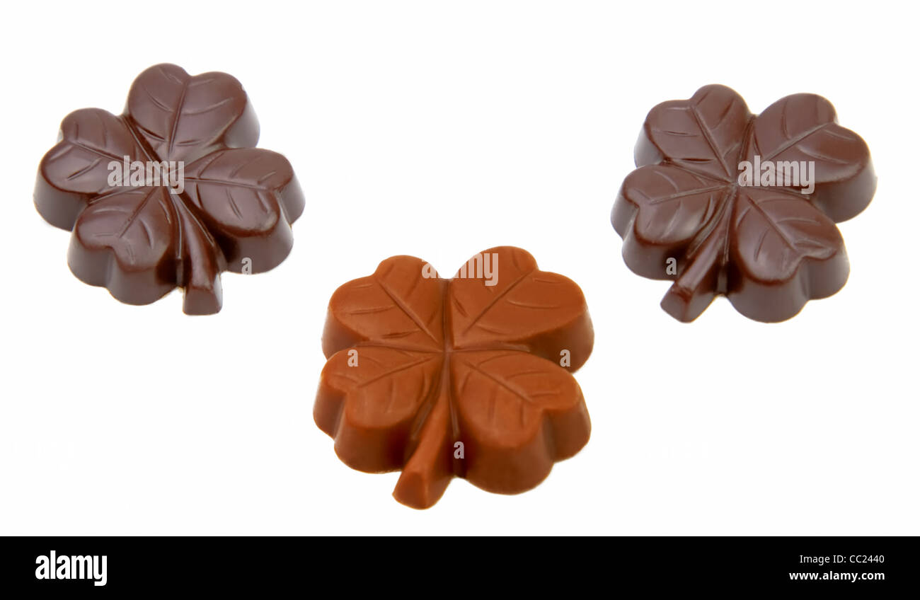 Three chocolate clover isolated over white background Stock Photo - Alamy