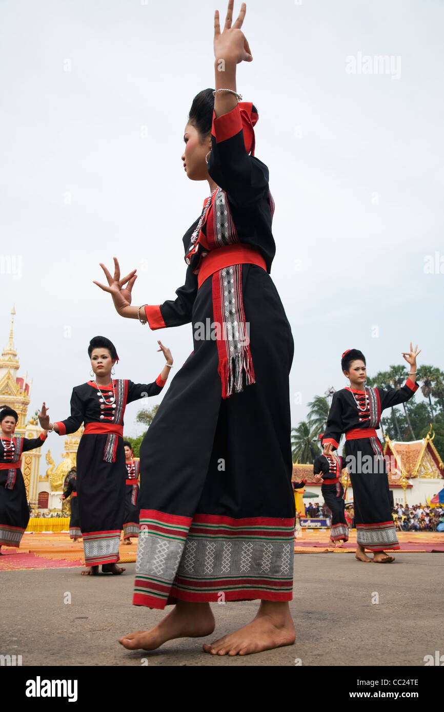 Dancers in traditional Isan dress perform in front of Wat Phra That ...