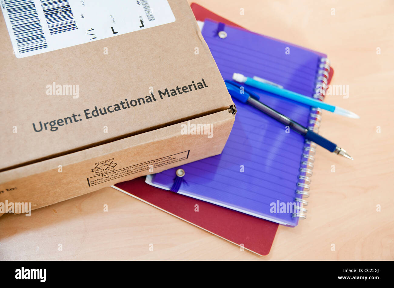 High angle shot of distance learning cardboard box with notebooks ...