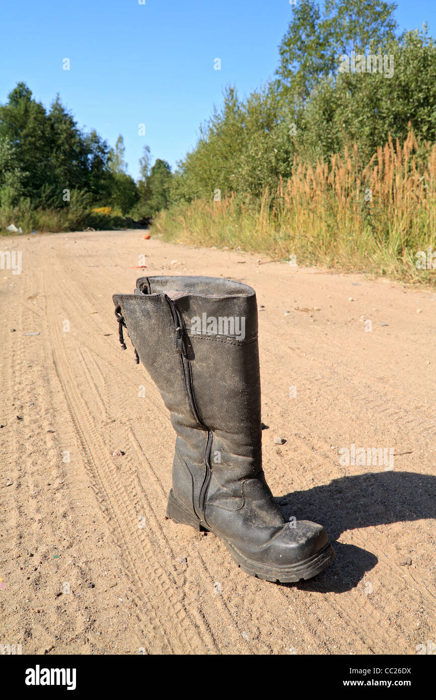 old boot on road Stock Photo - Alamy