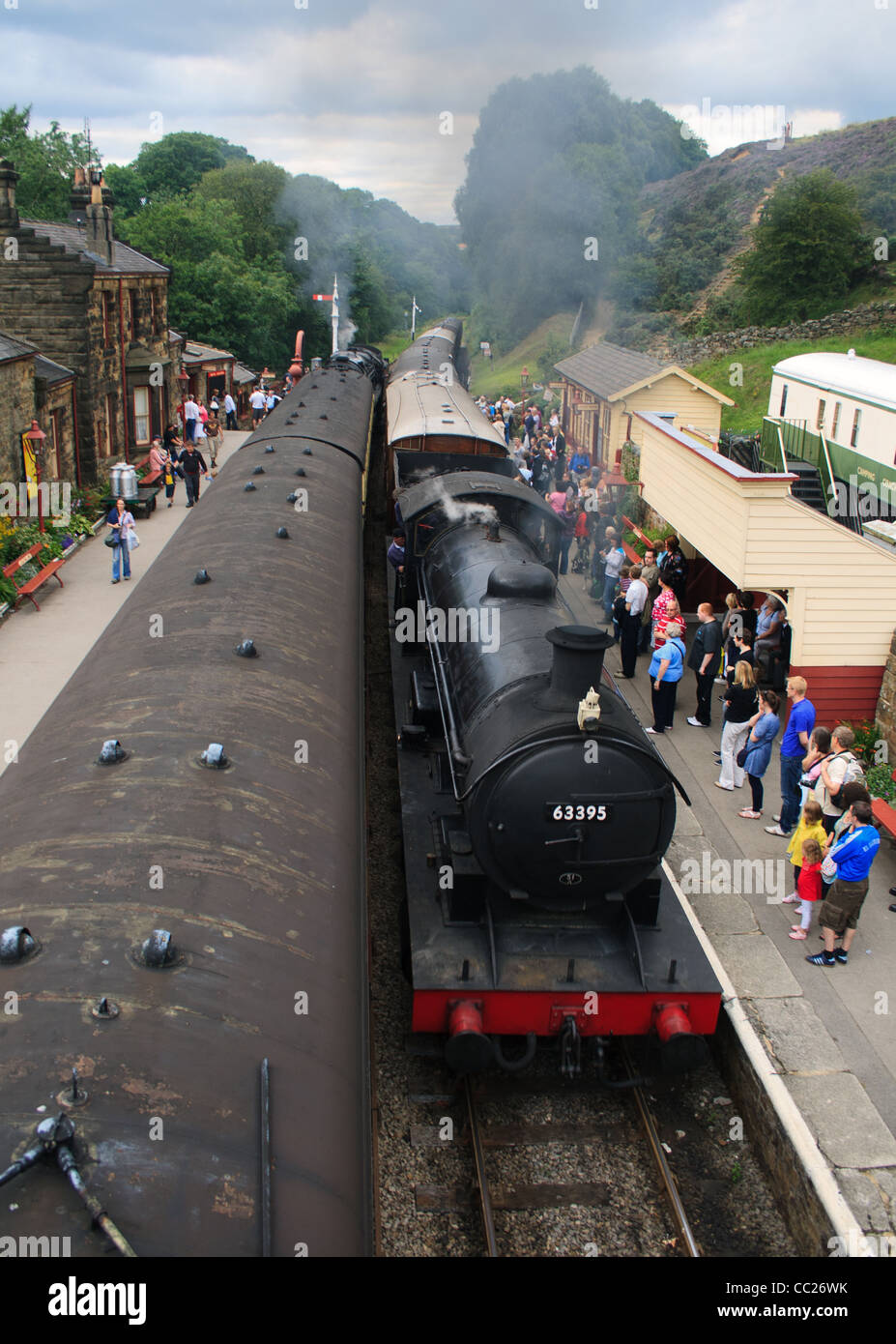 steam train arriving at station Stock Photo - Alamy