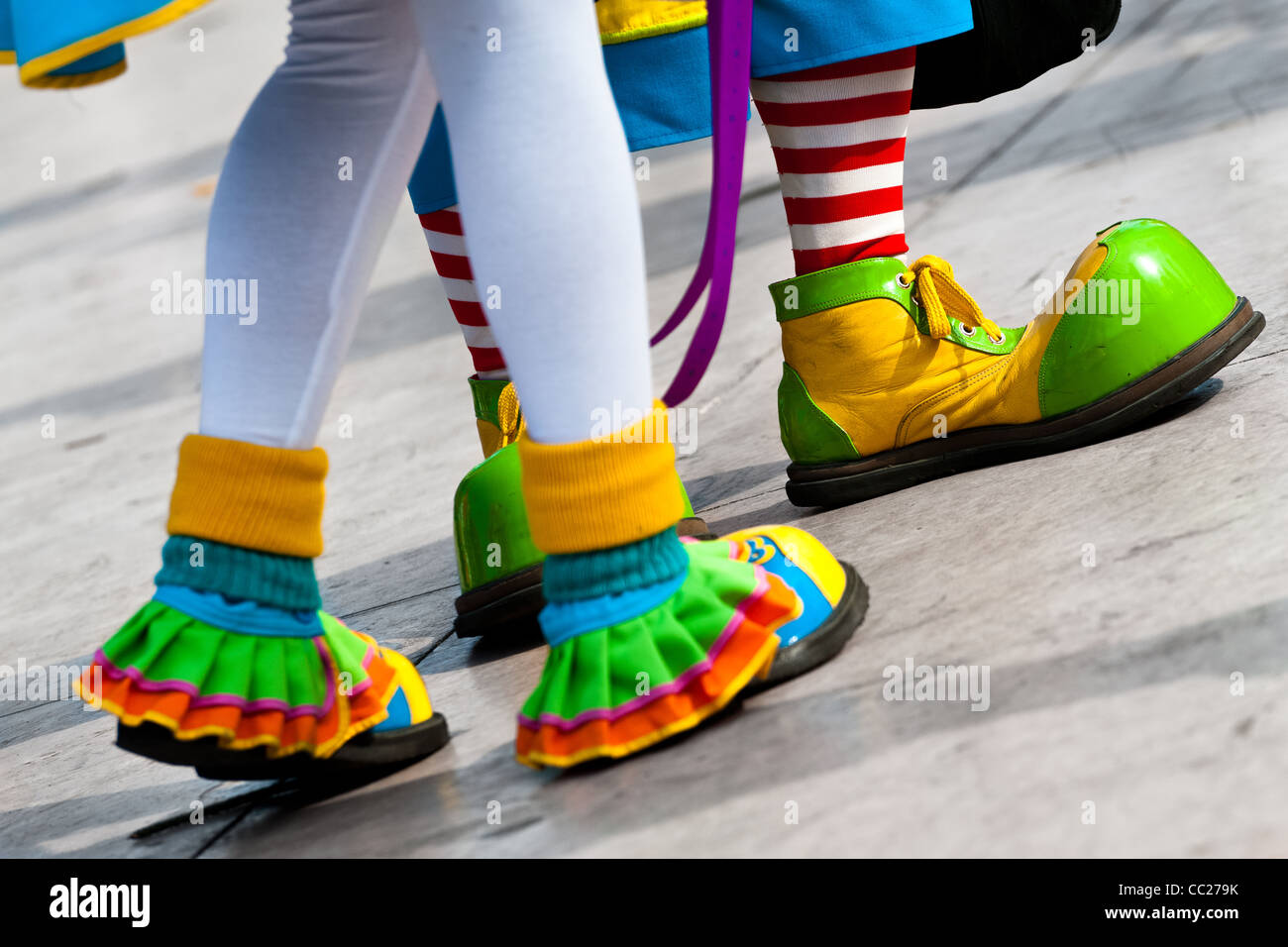 Clowns wear oversized multi colored shoes during the Clown Congress in ...