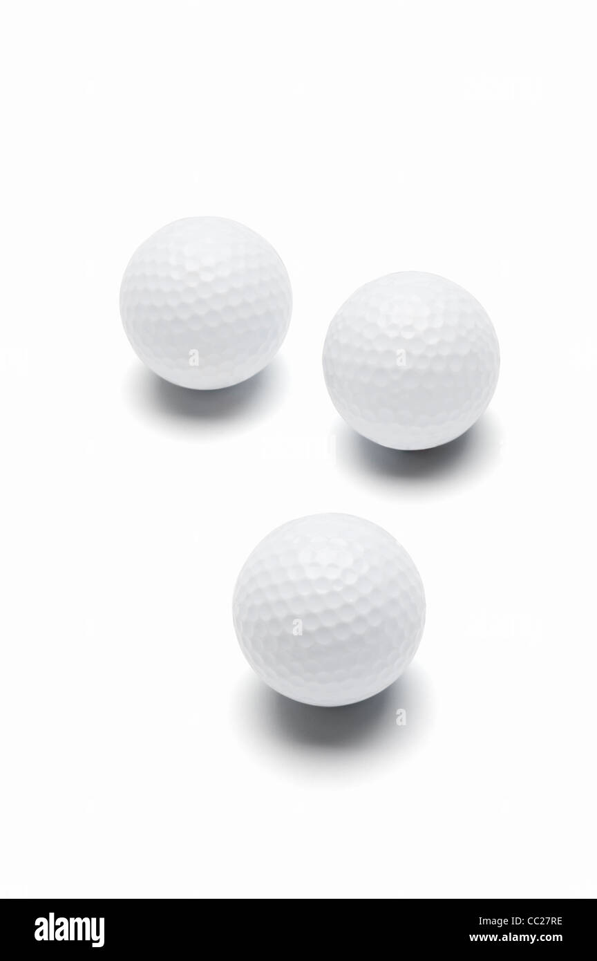 Three golf balls Stock Photo - Alamy