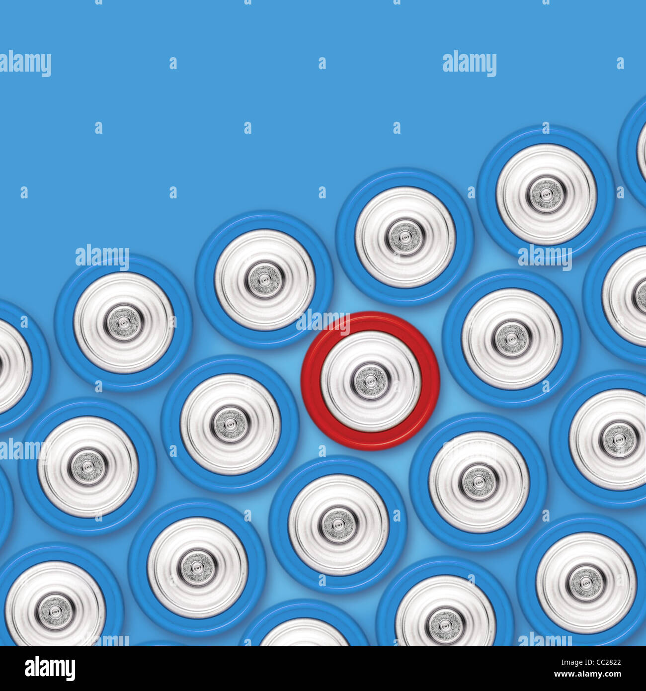 A red battery amongst a group of blue batteries Stock Photo - Alamy