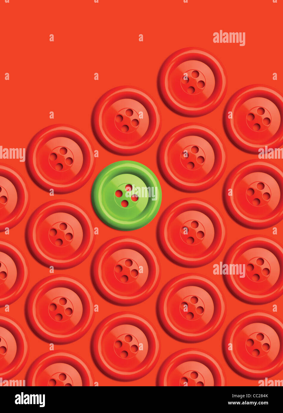 A green button amongst a group of red buttons Stock Photo - Alamy
