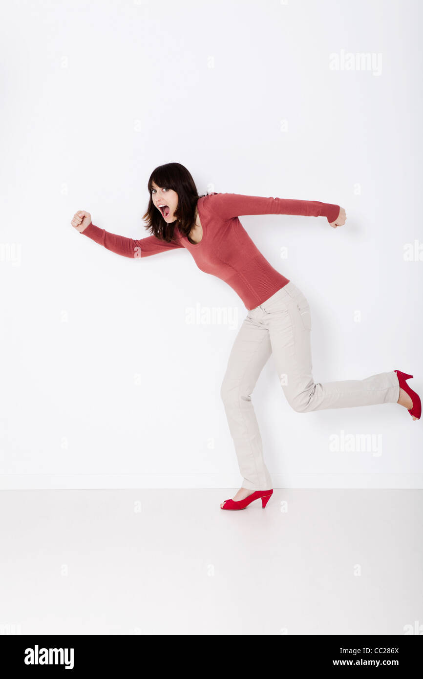 Lovely brunette woman running hi-res stock photography and images - Alamy