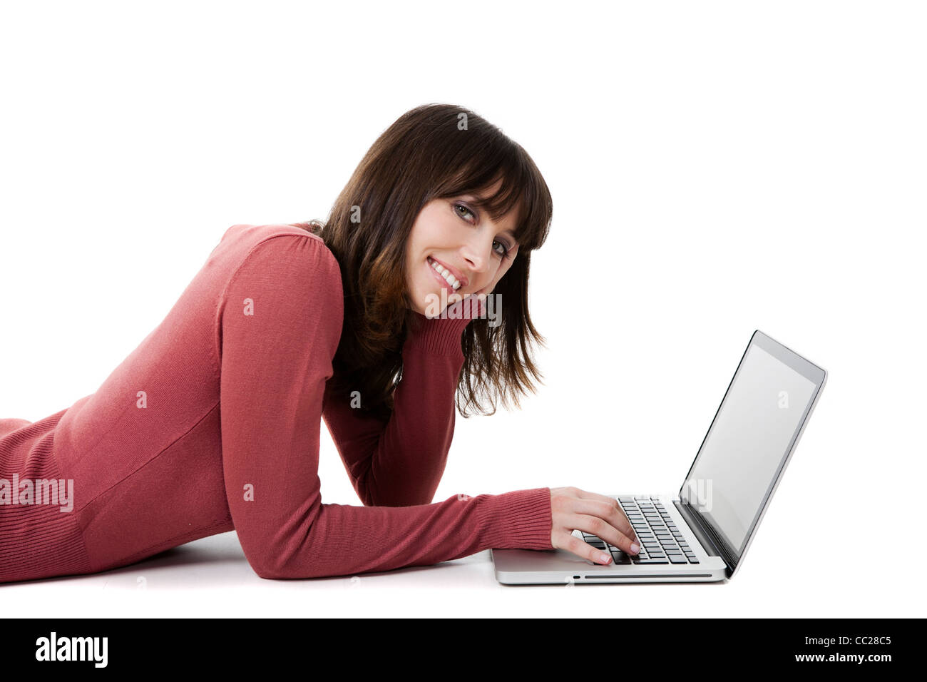 Beautiful woman with a laptop in studio with white background Stock ...