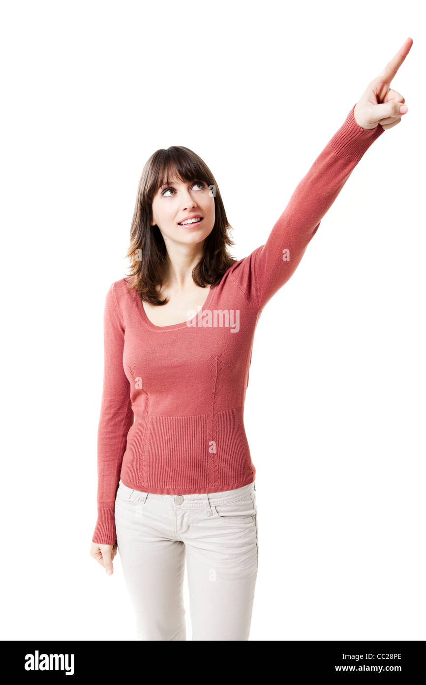Beautiful woman pointing up. Studio shot with isolated white background ...