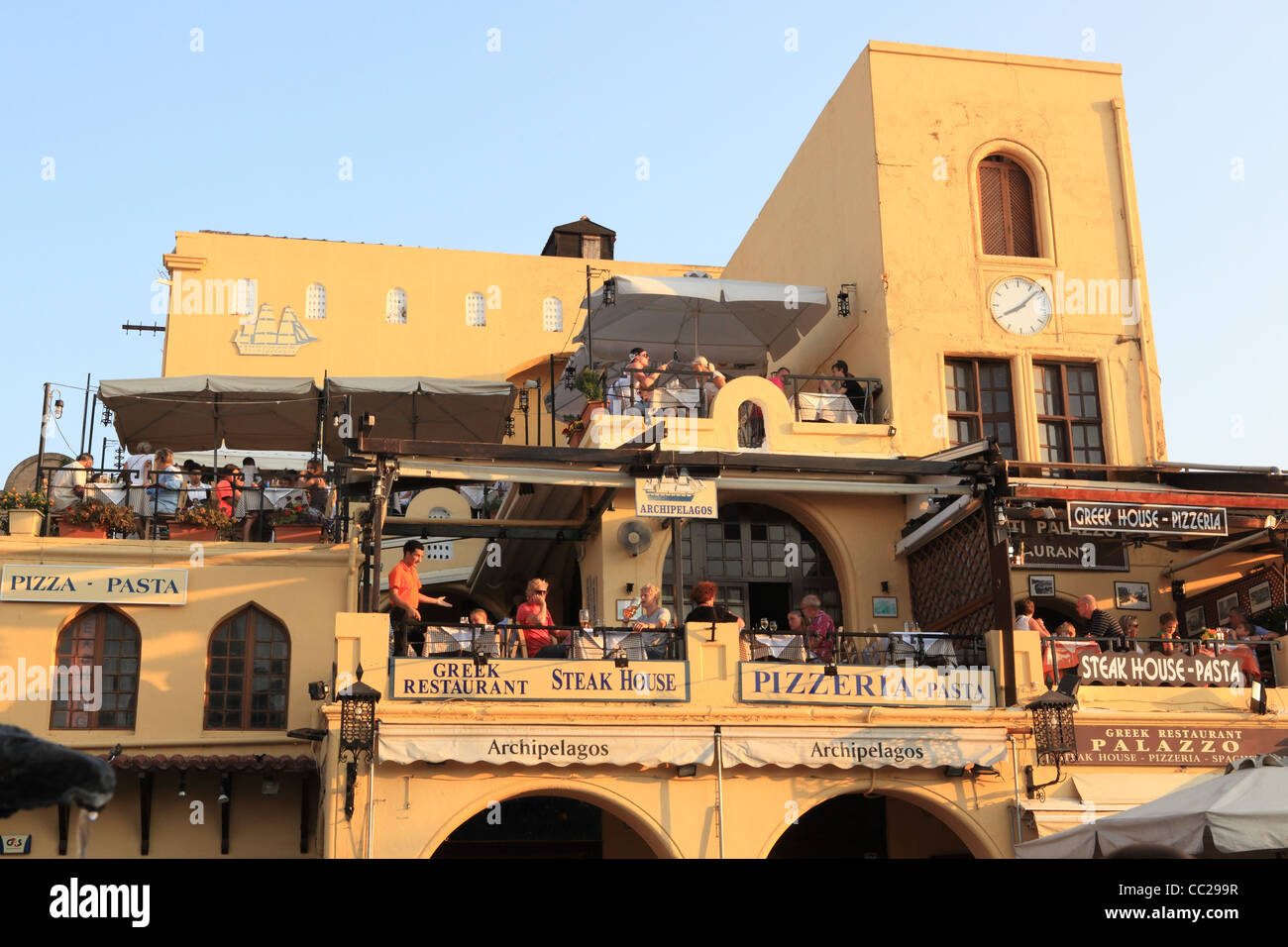 Pavement cafes and restaurants in Hippokrates Square, in Rhodes City ...
