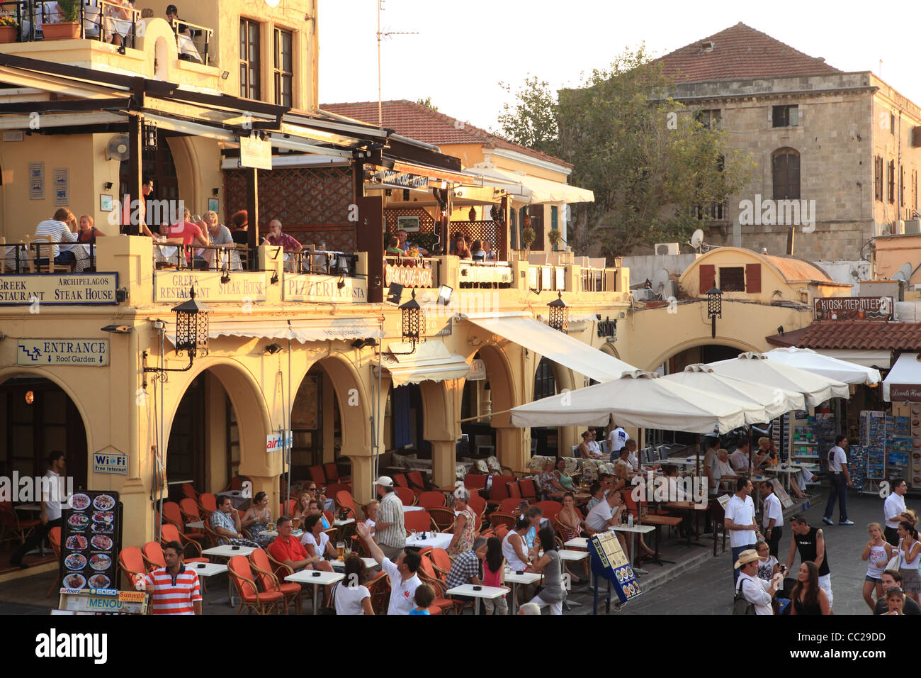 Pavement cafes and restaurants in Hippokrates Square, in Rhodes City ...