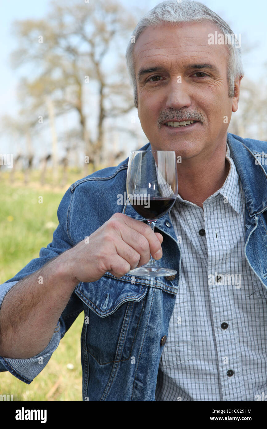 Man drinking wine in vineyard Stock Photo - Alamy