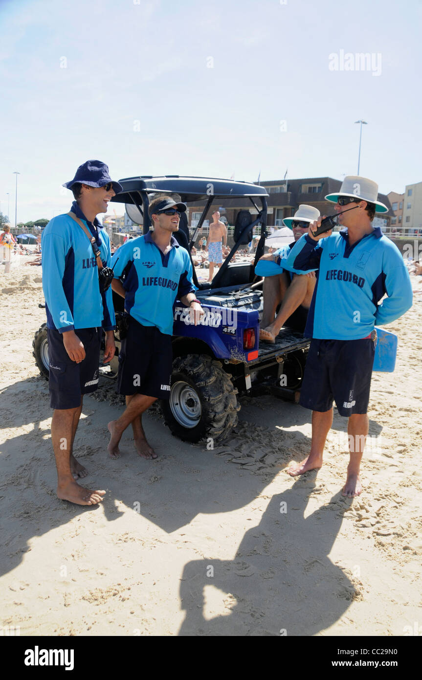 A group of professional lifeguards ( full-time) wearing blue kit with ...