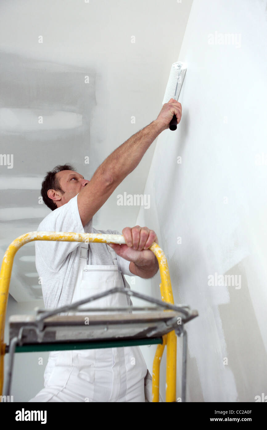 painter using roller Stock Photo - Alamy