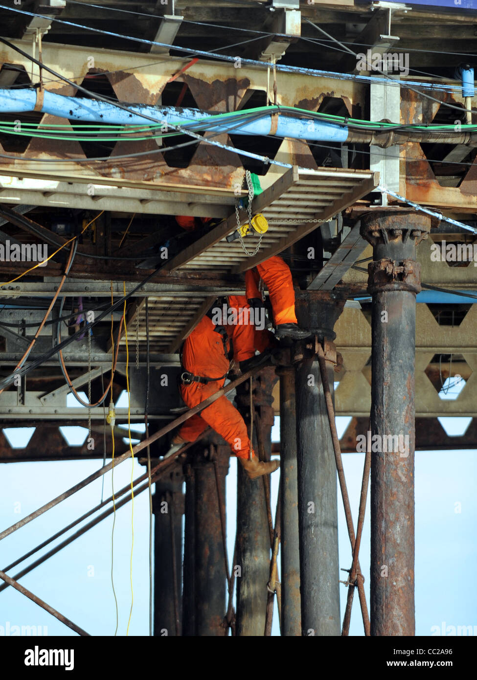 Workers above and below decking working on the £3.5 million ten year ...