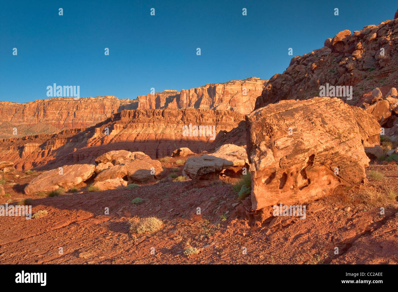 Boulders in front of Paria Plateau escarpment at Vermilion Cliffs ...