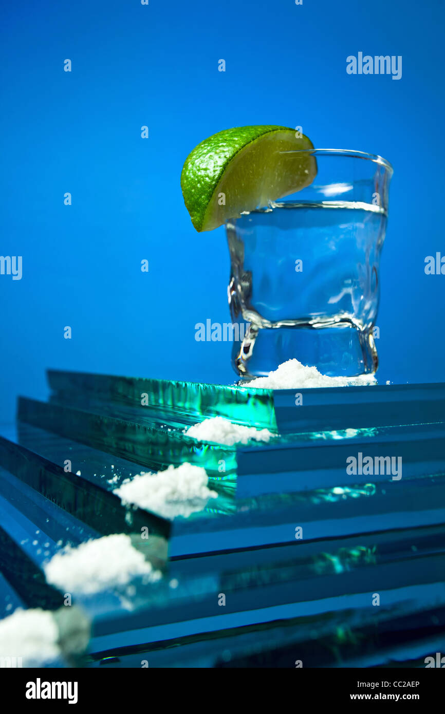tequila and lime on a glass pyramid Stock Photo - Alamy