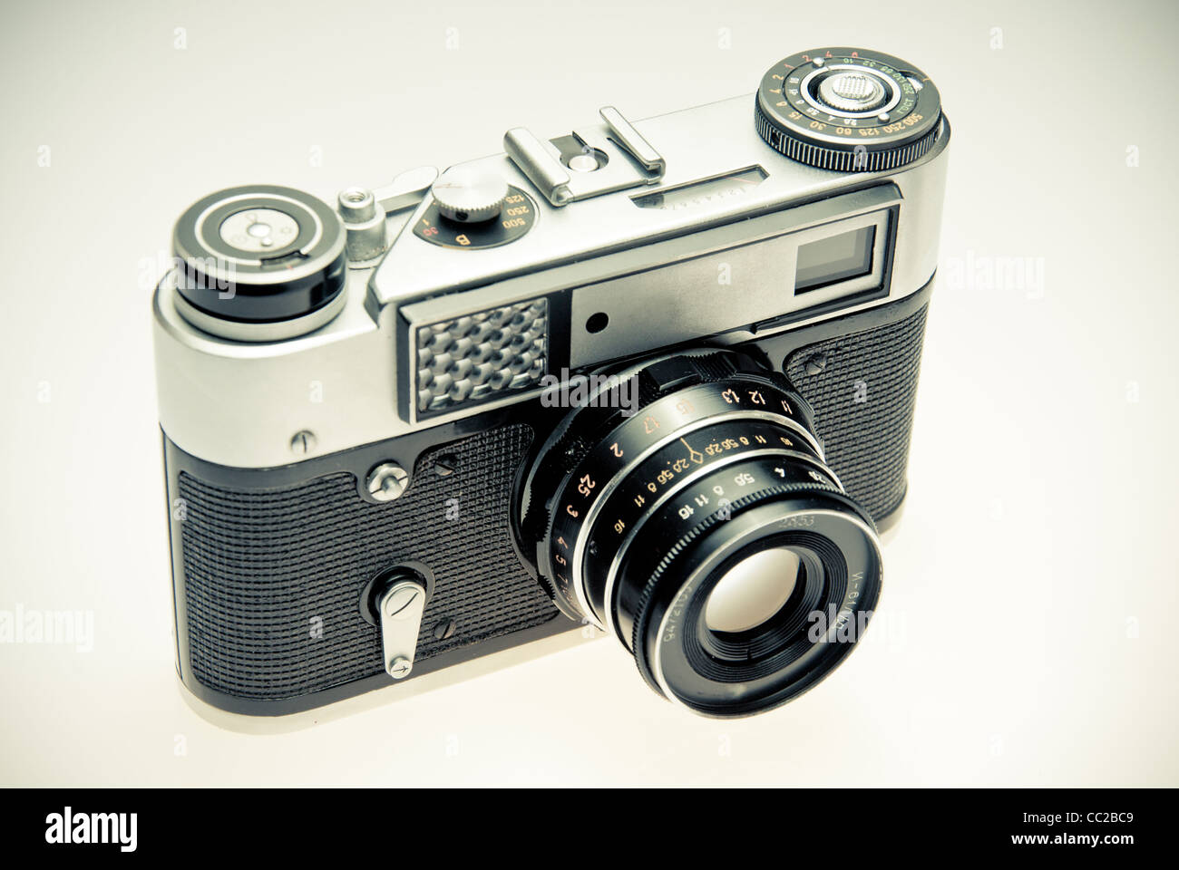 Old photography camera in vintage style over light background Stock ...