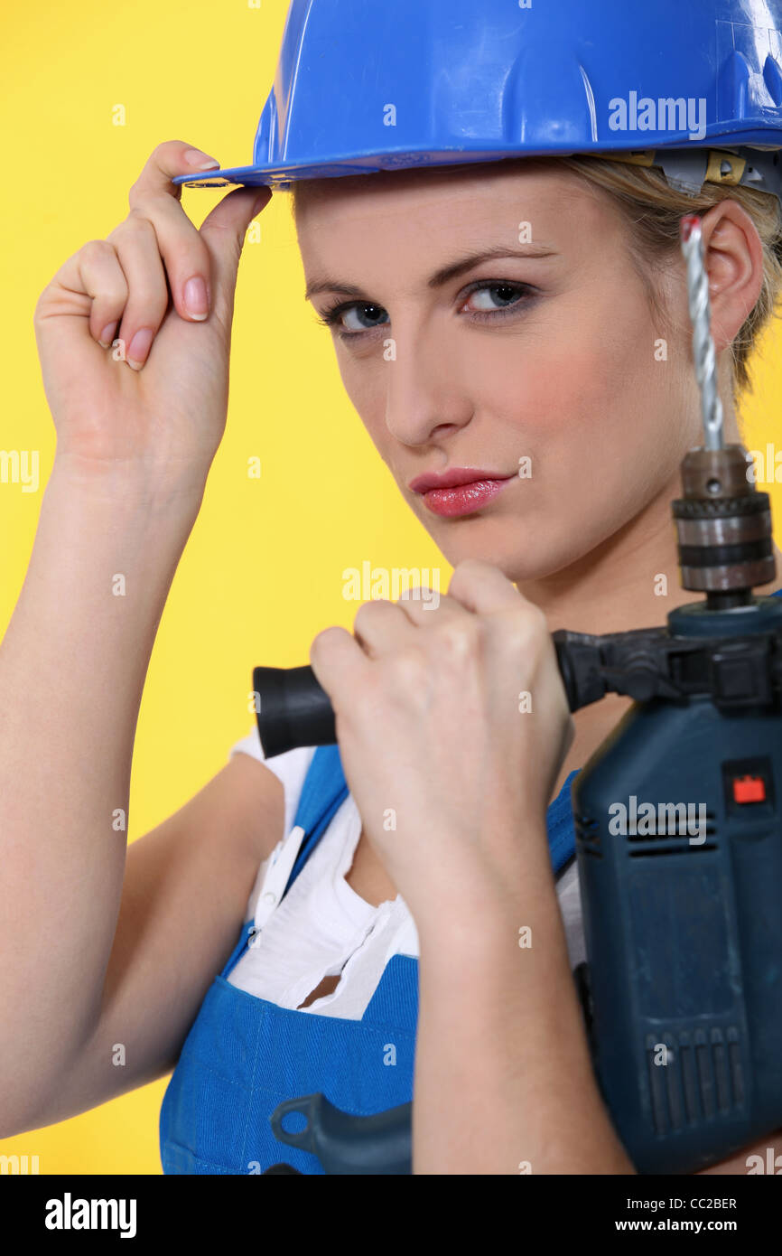 portrait of a woman with drill Stock Photo - Alamy