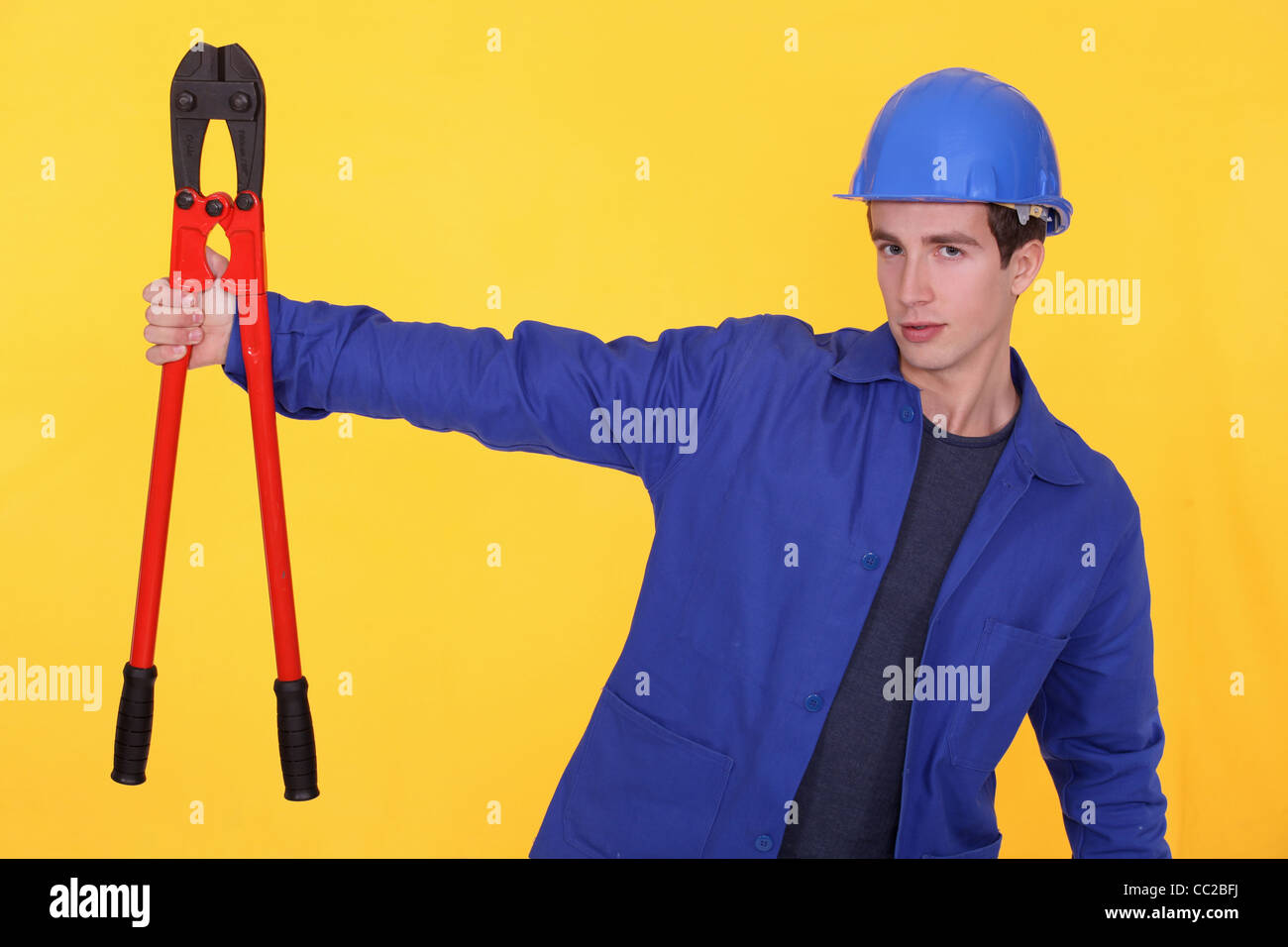 craftsman holding a huge spanner Stock Photo - Alamy