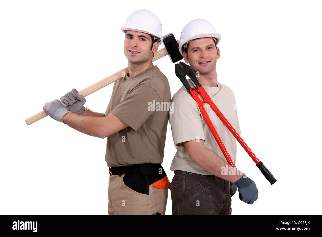 Construction worker holding heavy-duty tools Stock Photo - Alamy