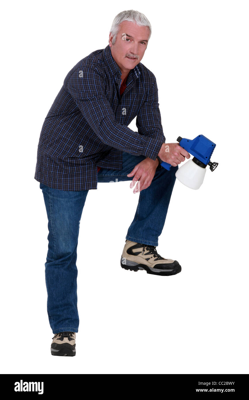 Man with a spray gun Stock Photo - Alamy