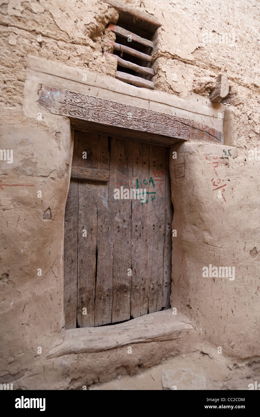 Islamic carved wooden beam at the historic village of El-Qasr at Dakhla ...