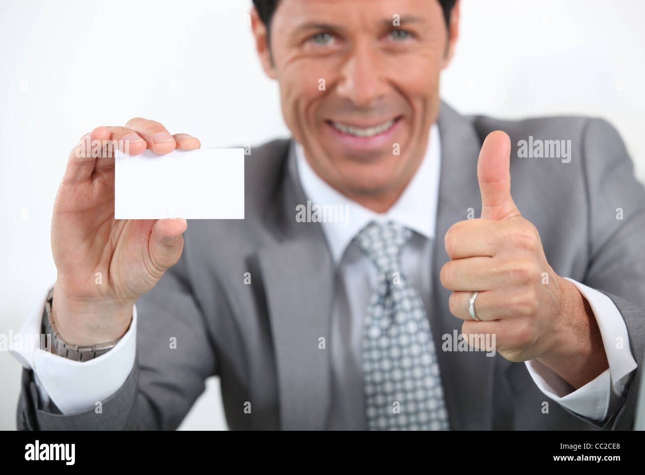 Businessman holding big card hi-res stock photography and images - Alamy