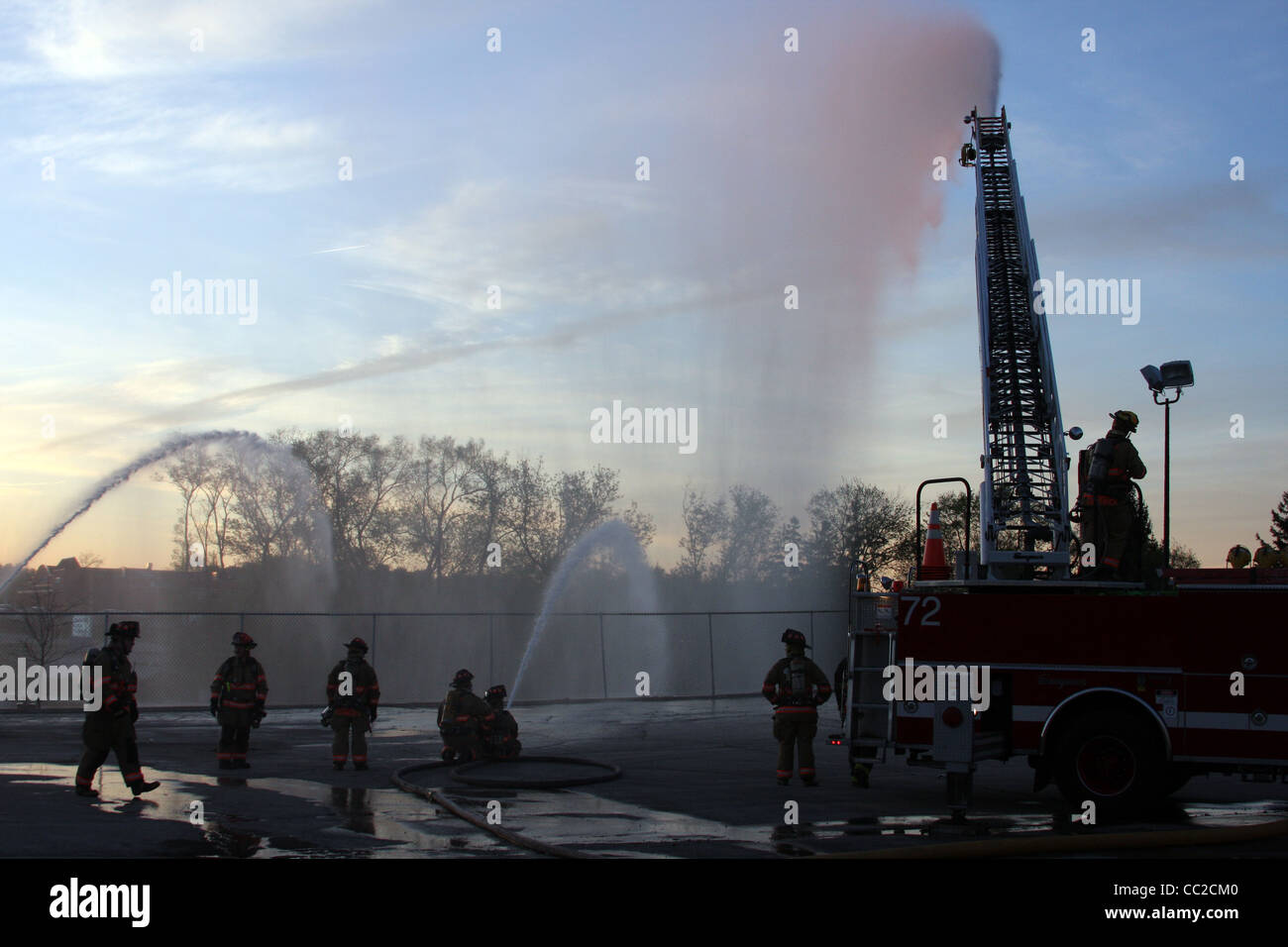 Multiple sources of water being projected at a fire scene Stock Photo ...