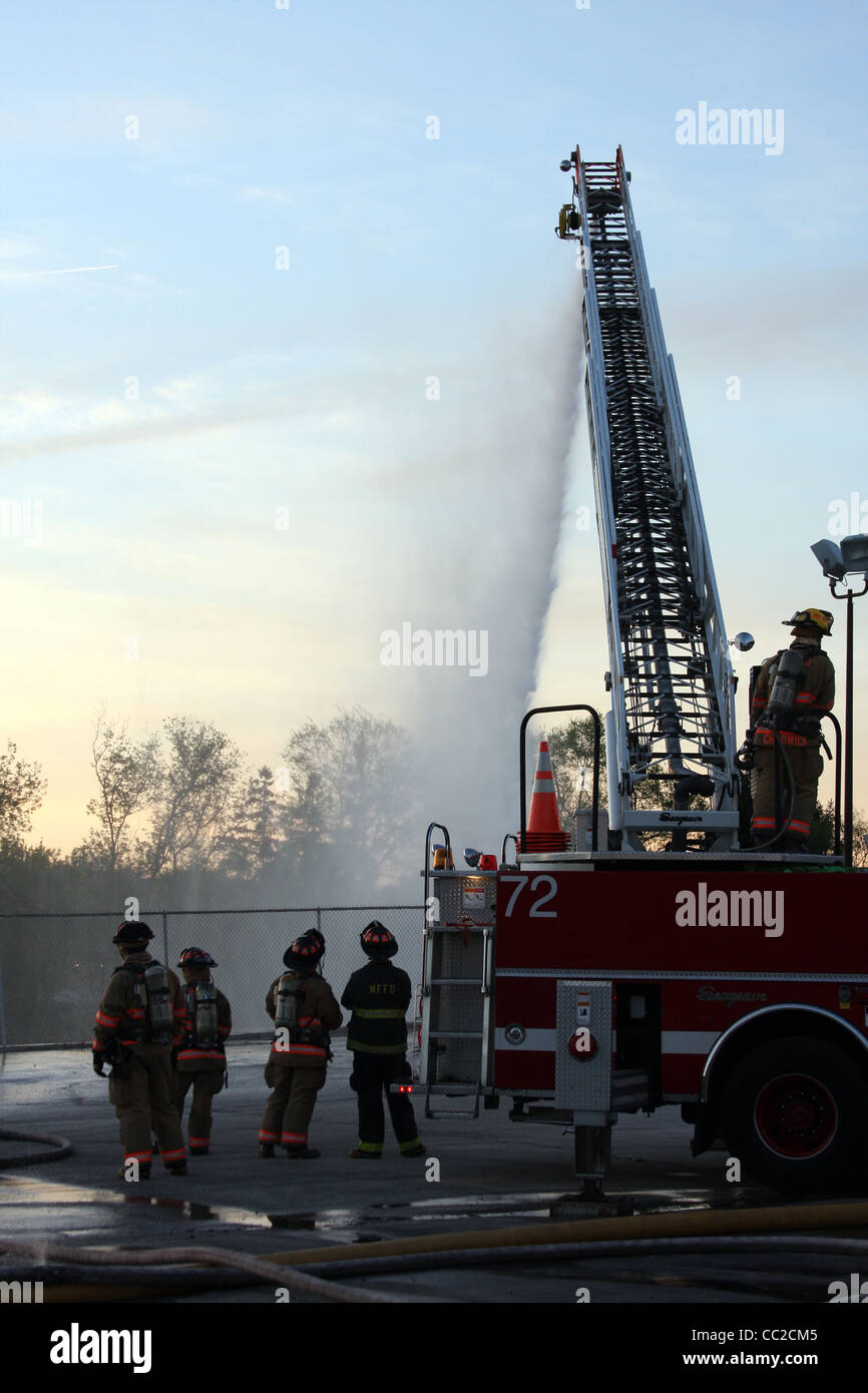 Multiple sources of water being projected at a fire scene Stock Photo ...