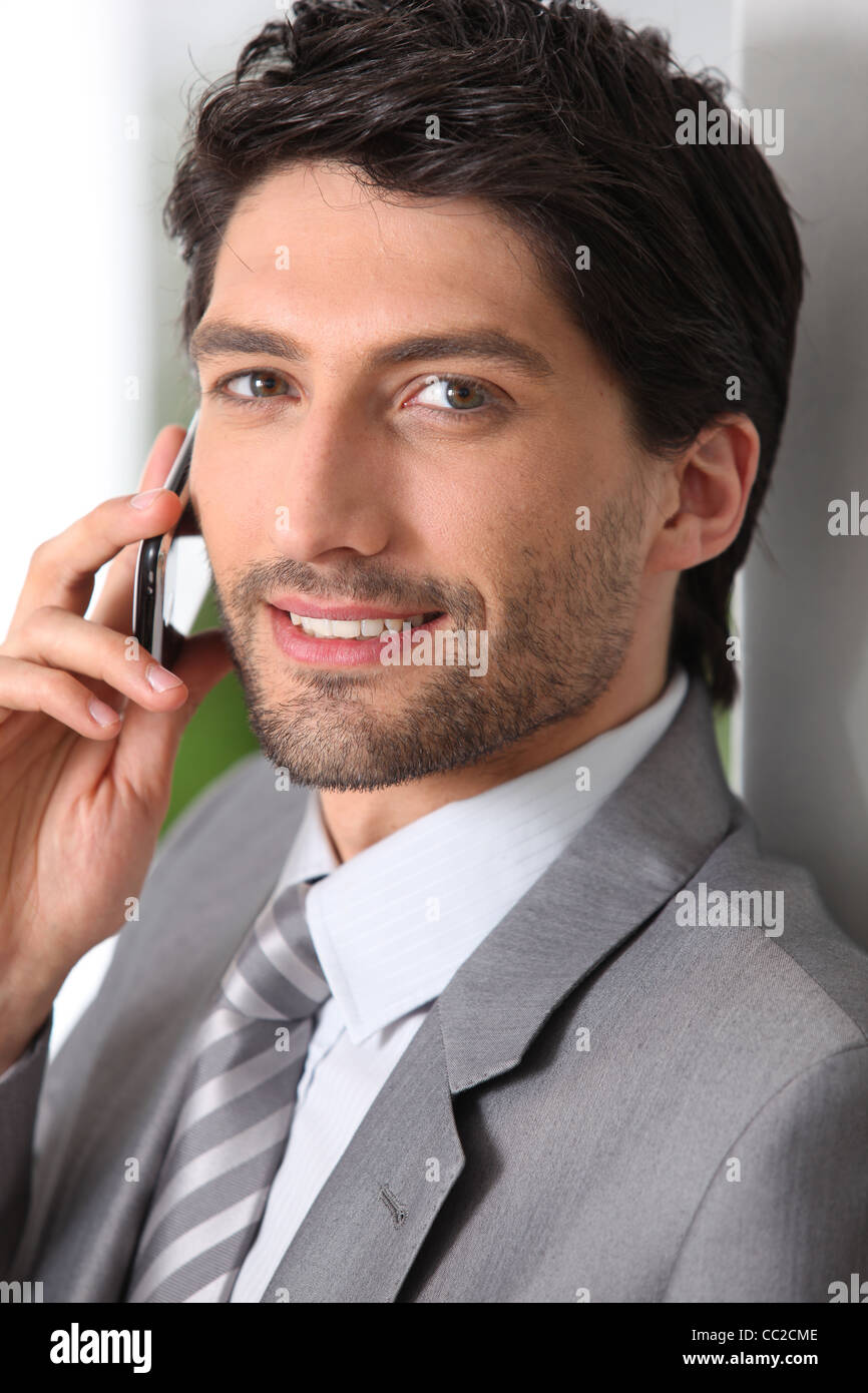 Businessman making call using mobile telephone Stock Photo - Alamy