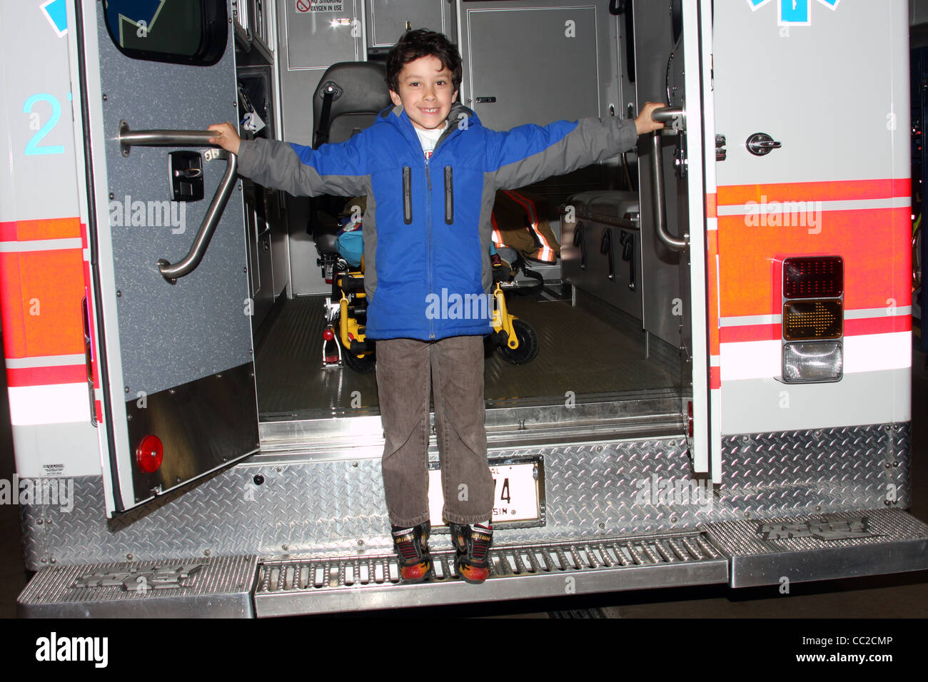 A young boy standing at the back of an ambulance Stock Photo - Alamy