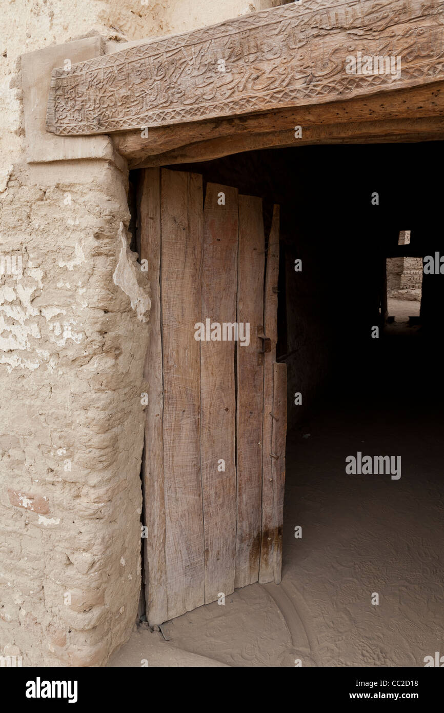 Islamic carved wooden beam at the historic village of El-Qasr at Dakhla ...