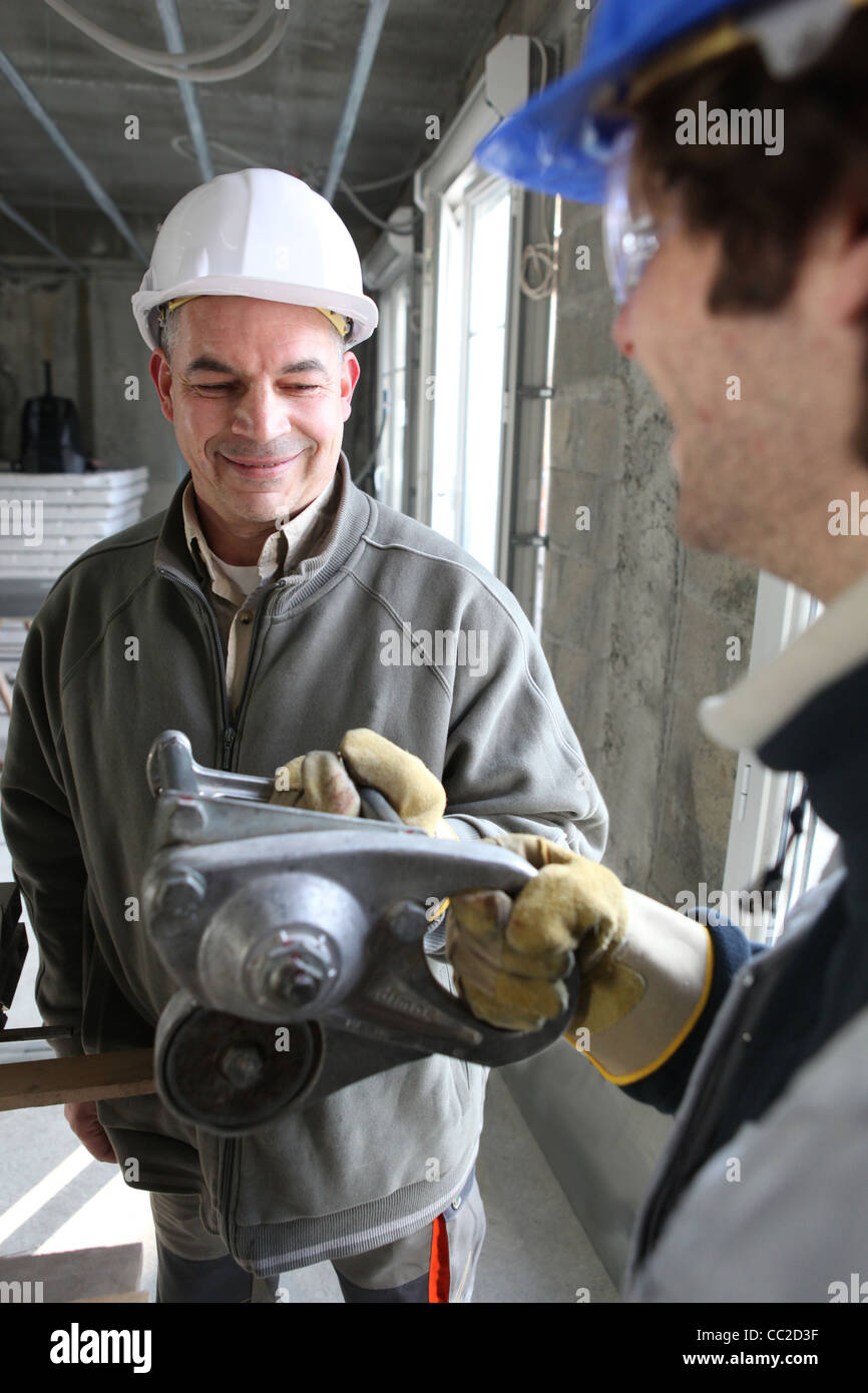 Construction workers inside a housebuild Stock Photo - Alamy
