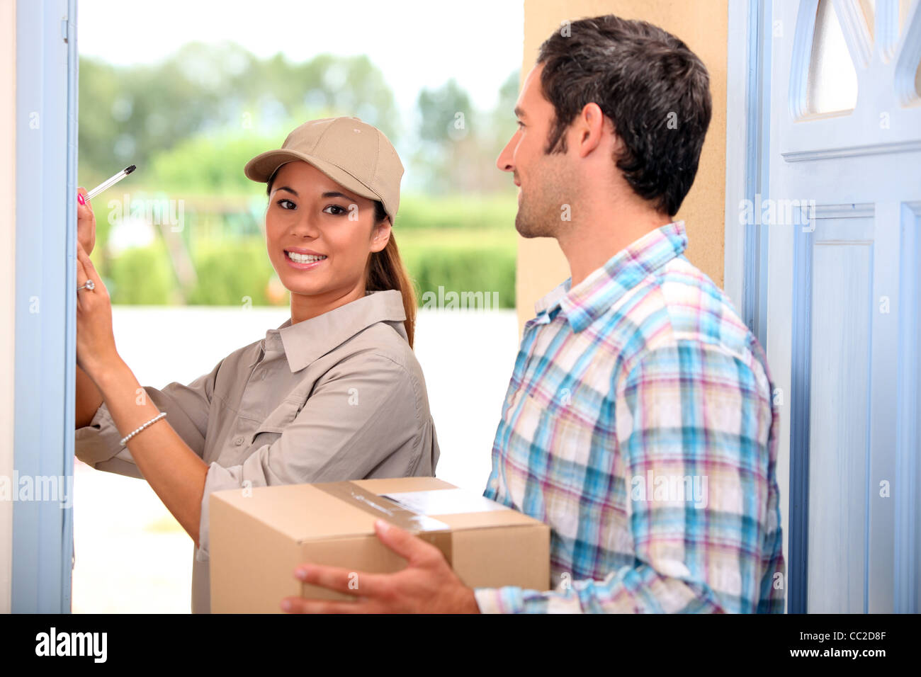 Woman receiving post packet hi-res stock photography and images - Alamy