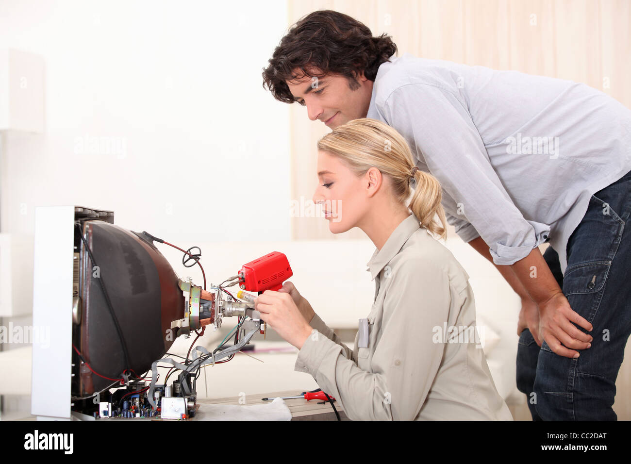 female technician doing repairs Stock Photo - Alamy