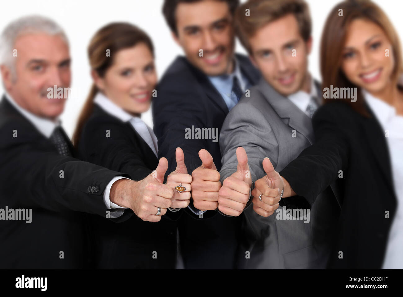 Manager and his team all giving a strong thumbs up Stock Photo - Alamy