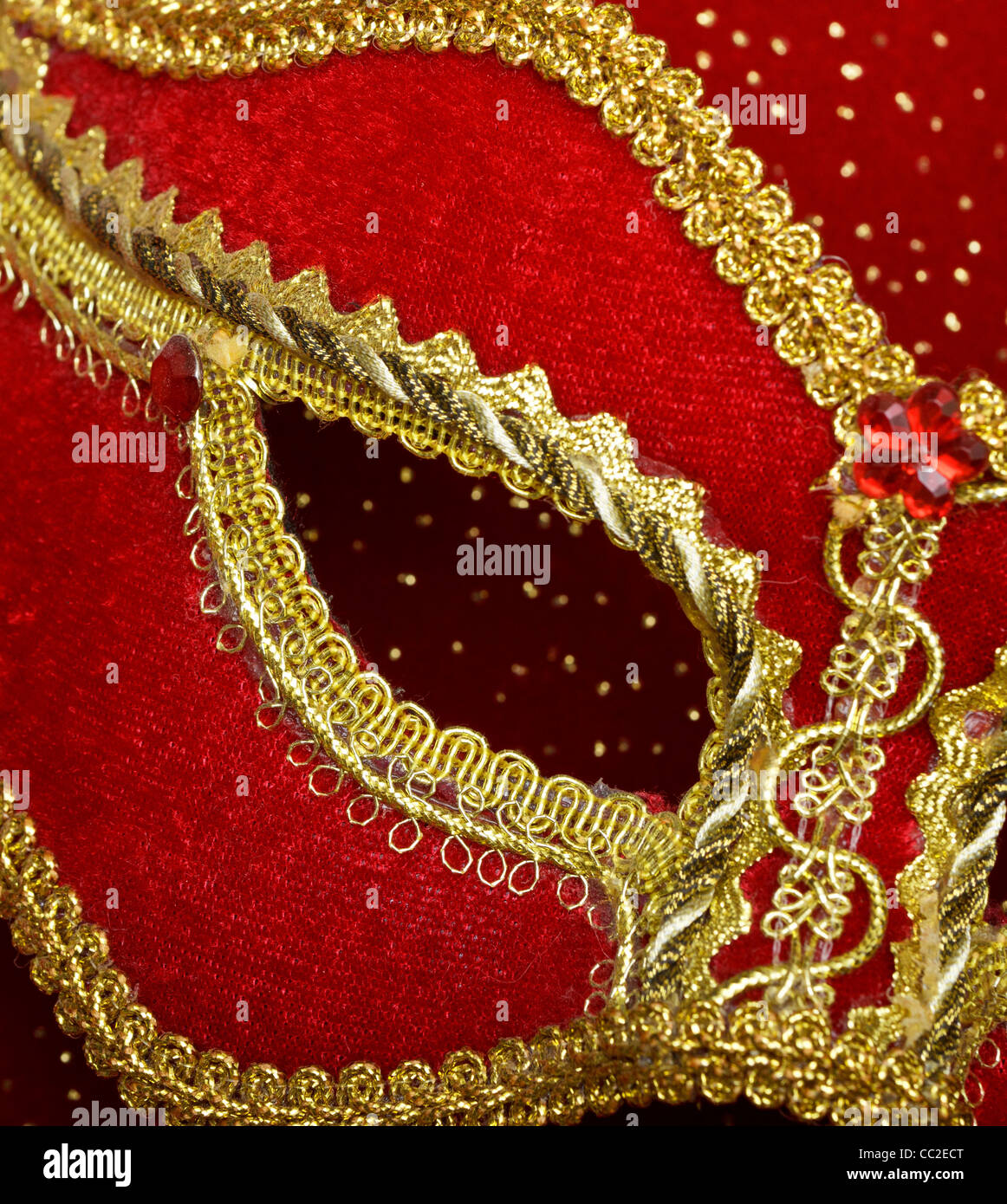 photo of fragment theatrical mask on red background Stock Photo - Alamy