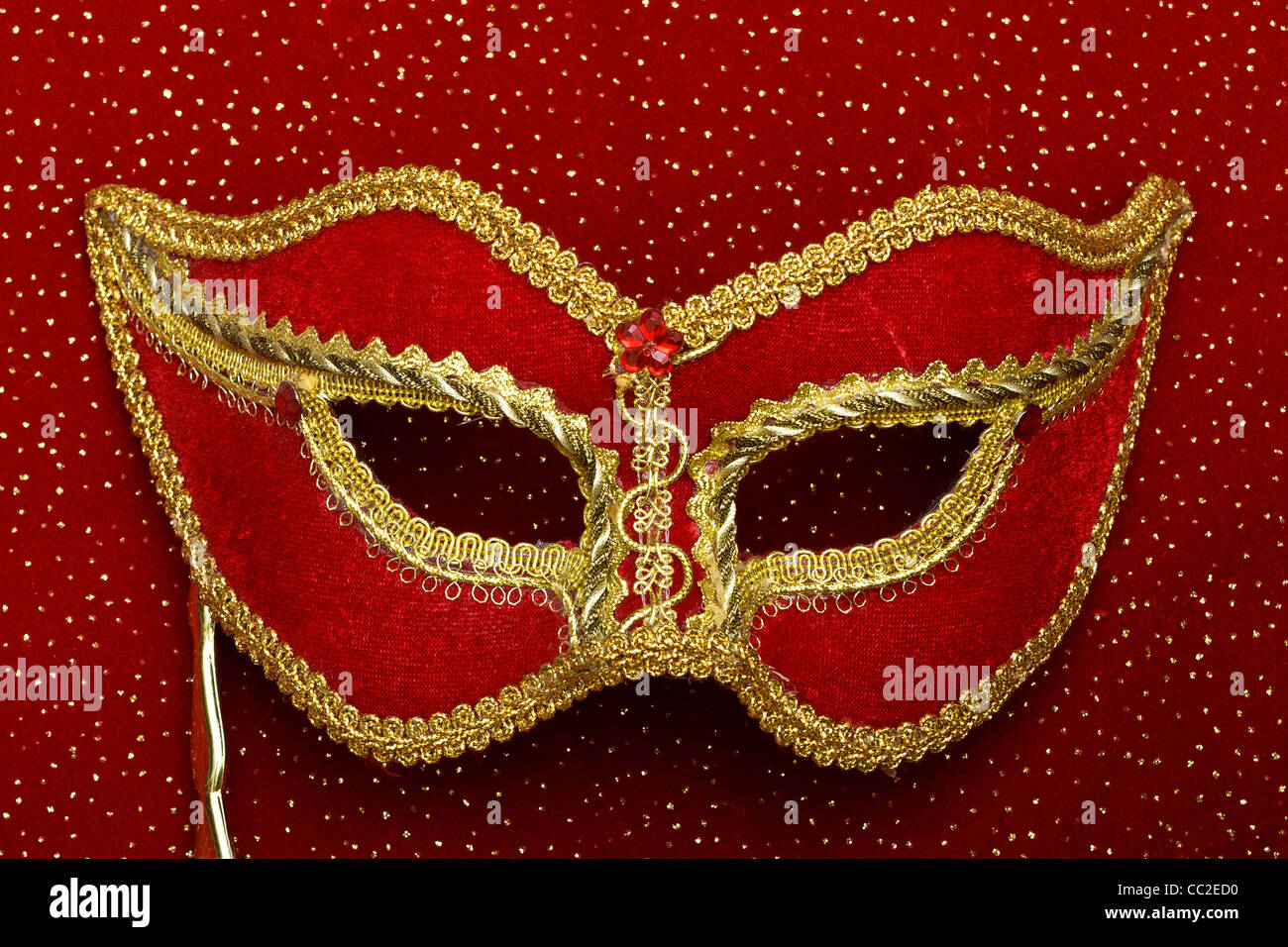 photo of theatrical mask on red background Stock Photo - Alamy