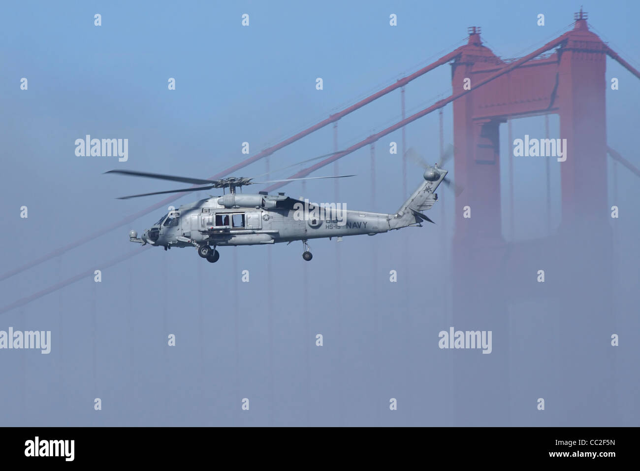 A U.S. Navy UH-60 Sea Hawk flies near one of the Golden Gate Bridge ...